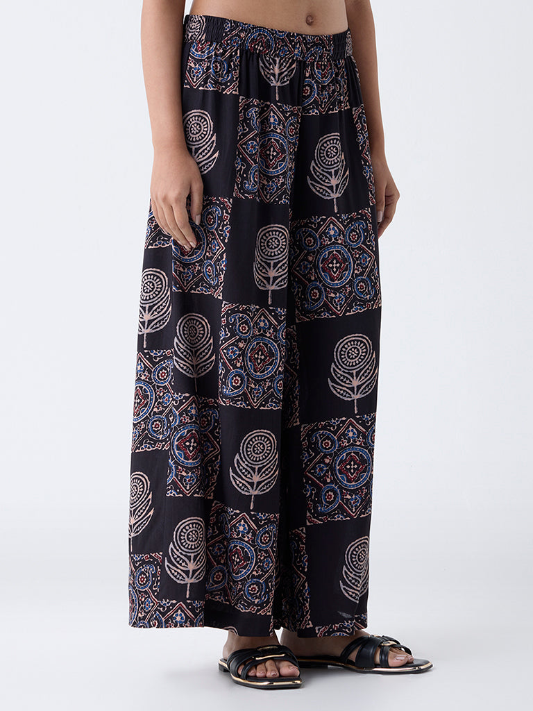 Buy Utsa Black Printed Palazzos from Westside